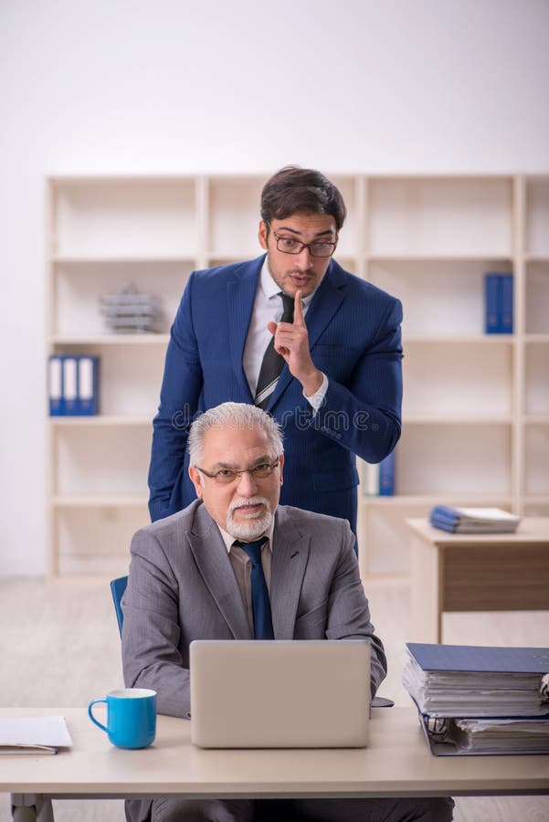 Old Male Boss and Young Male Employee in the Office Stock Image - Image ...
