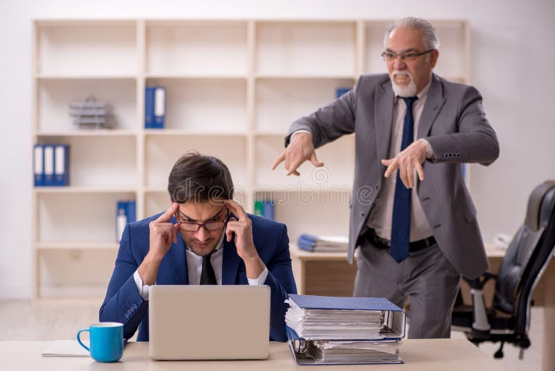 Old Male Boss and Young Male Employee in the Office Stock Photo - Image ...