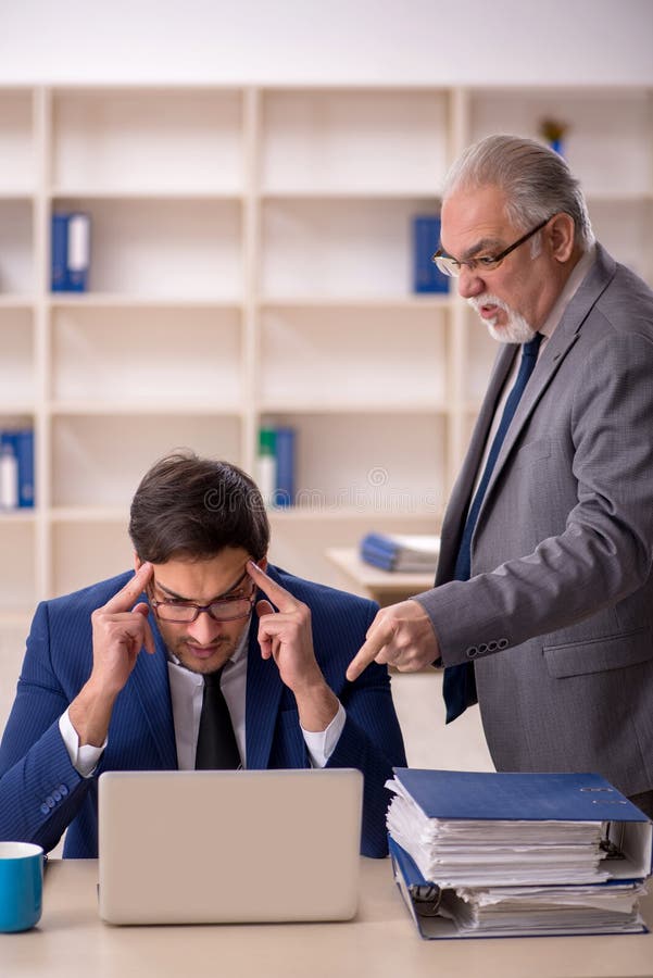 Old Male Boss and Young Male Employee in the Office Stock Image - Image ...