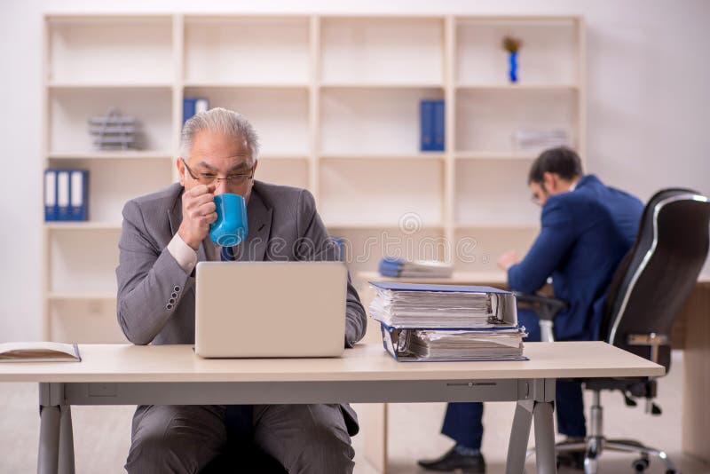 Old Male Boss and Young Male Employee in the Office Stock Image - Image ...