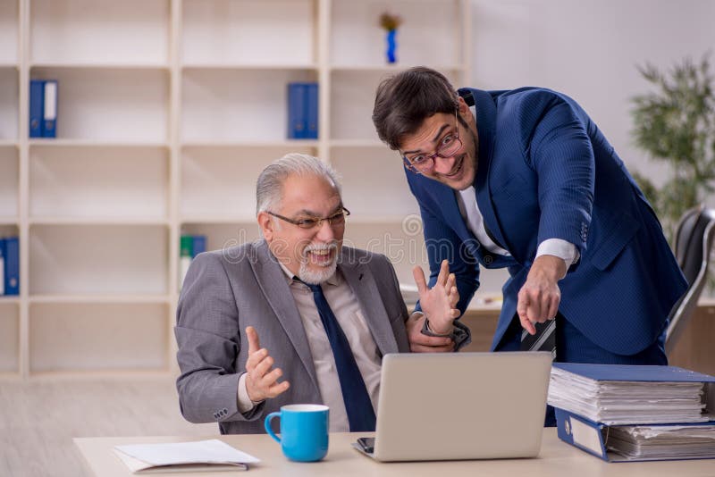 Old Male Boss and Young Male Employee in the Office Stock Image - Image ...