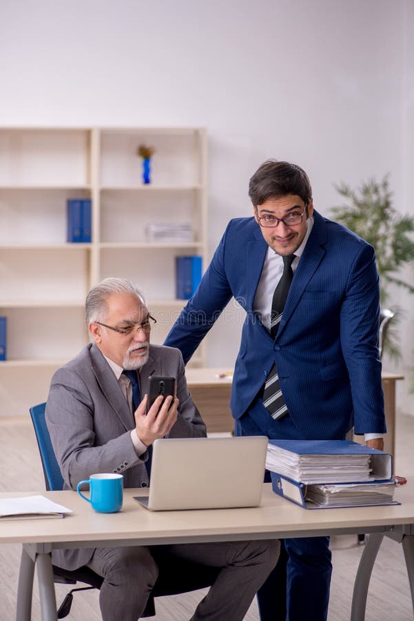 Old Male Boss and Young Male Employee in the Office Stock Image - Image ...