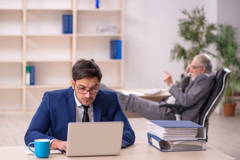 Old Male Boss and Young Male Employee in the Office Stock Image - Image ...