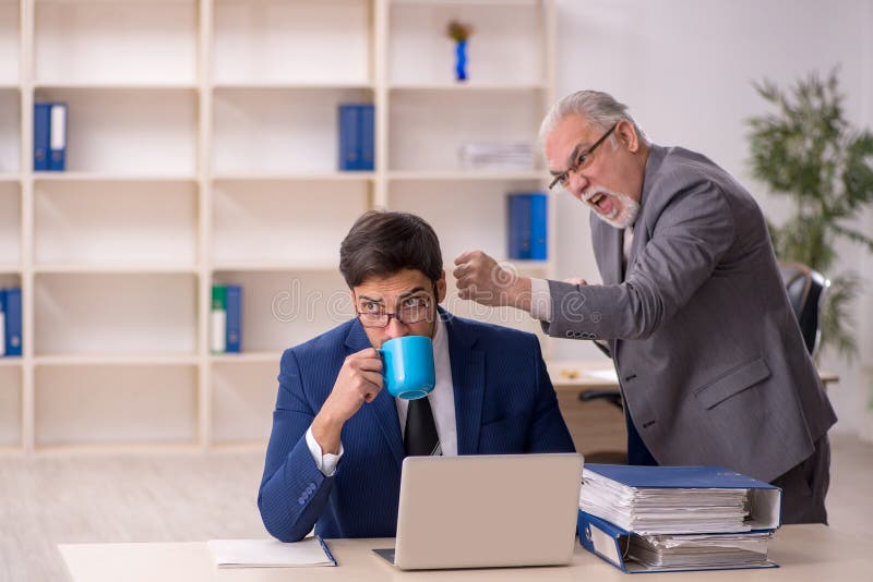 Old Male Boss and Young Male Employee in the Office Stock Image - Image ...
