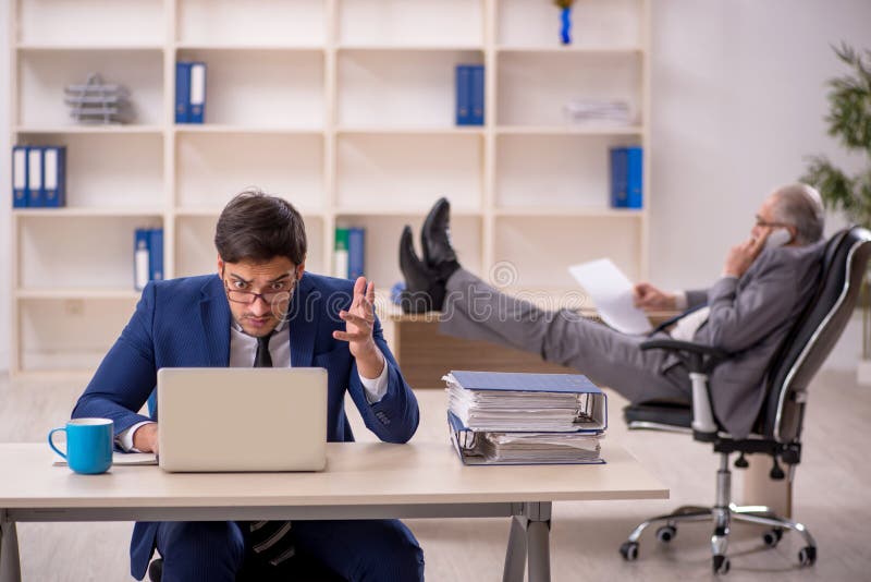 Old Male Boss and Young Male Employee in the Office Stock Image - Image ...