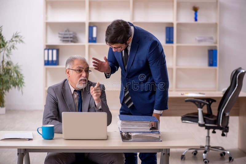 Old Male Boss and Young Male Employee in the Office Stock Image - Image ...