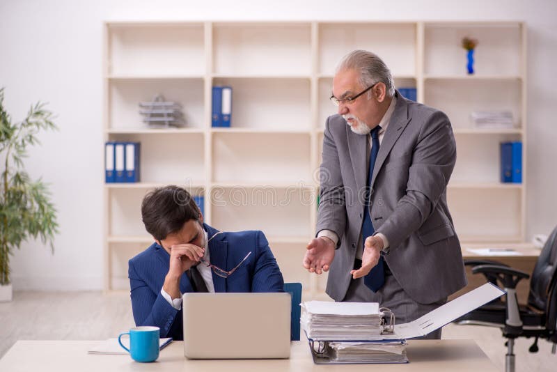 Old Male Boss and Young Male Employee in the Office Stock Image - Image ...