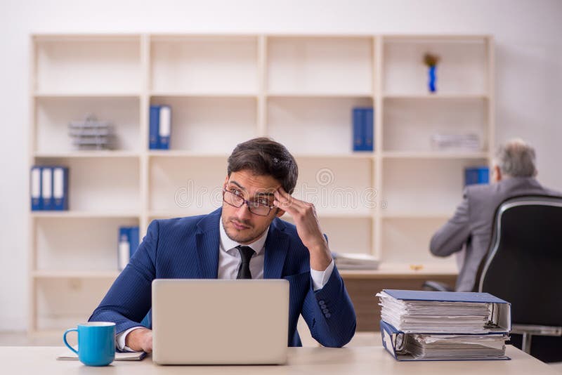Old Male Boss and Young Male Employee in the Office Stock Image - Image ...
