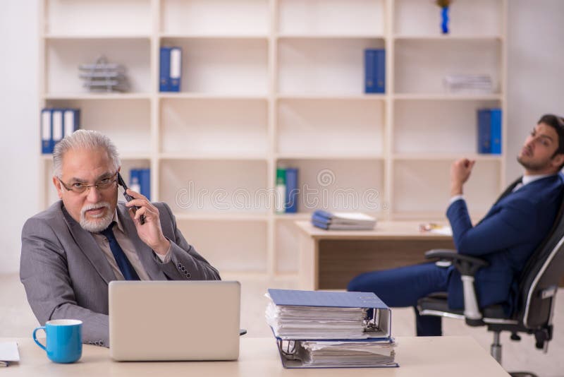 Old Male Boss and Young Male Employee in the Office Stock Image - Image ...