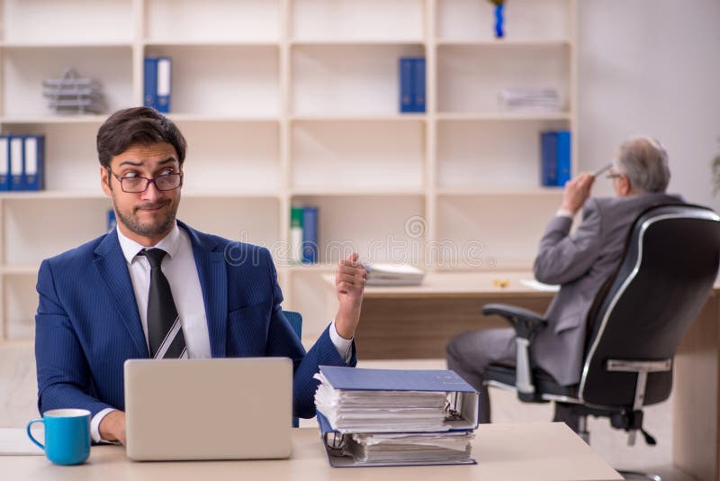 Old Male Boss and Young Male Employee in the Office Stock Photo - Image ...