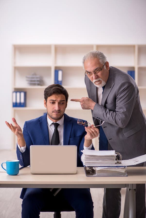 Old Male Boss and Young Male Employee in the Office Stock Image - Image ...
