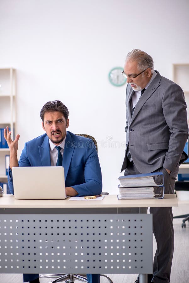 Old Male Boss and Young Male Employee Working in the Office Stock Image ...