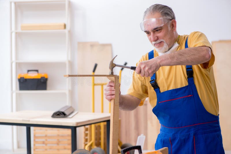 Old Male Carpenter Working in Workshop Stock Image - Image of phone ...