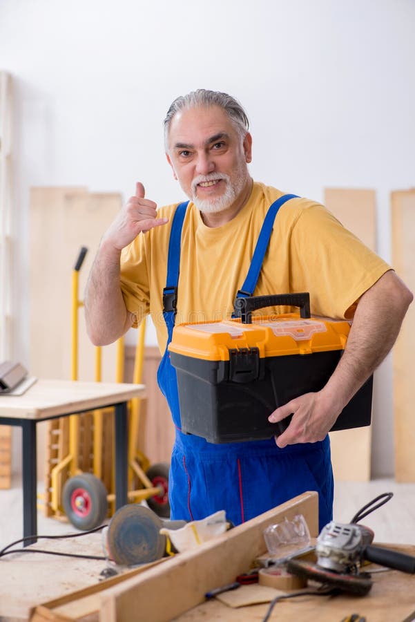 Old Male Carpenter Working in Workshop Stock Image - Image of phone ...