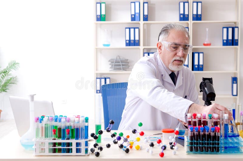 The Old Male Chemist Working in the Lab Stock Photo - Image of liquid ...