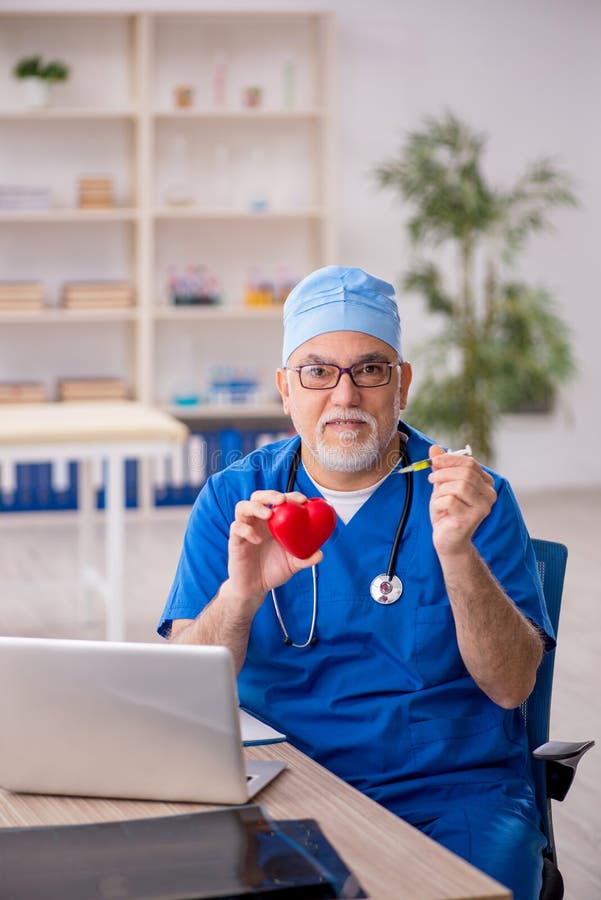 Old Male Doctor Cardiologist Working in the Clinic Stock Image - Image ...