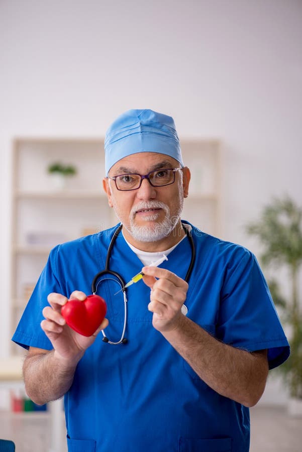 Old Male Doctor Cardiologist Working in the Clinic Stock Image - Image ...