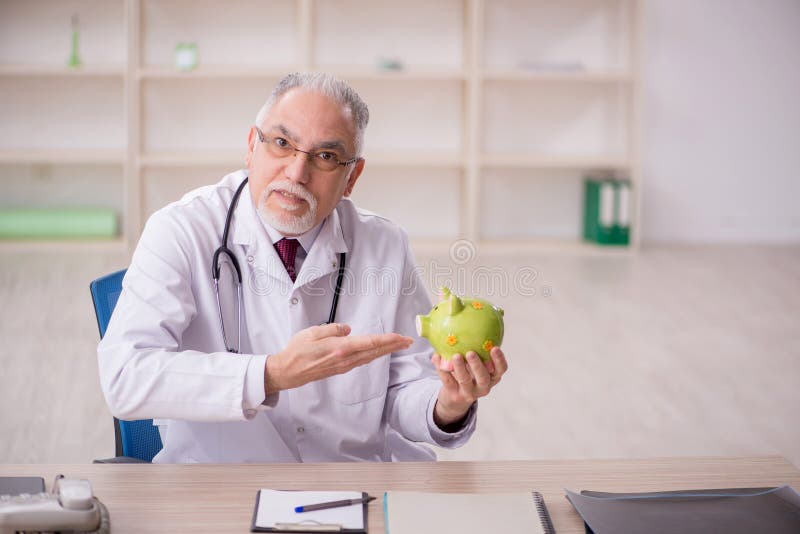 Old Male Doctor in Planning Retirement Concept Stock Photo - Image of ...