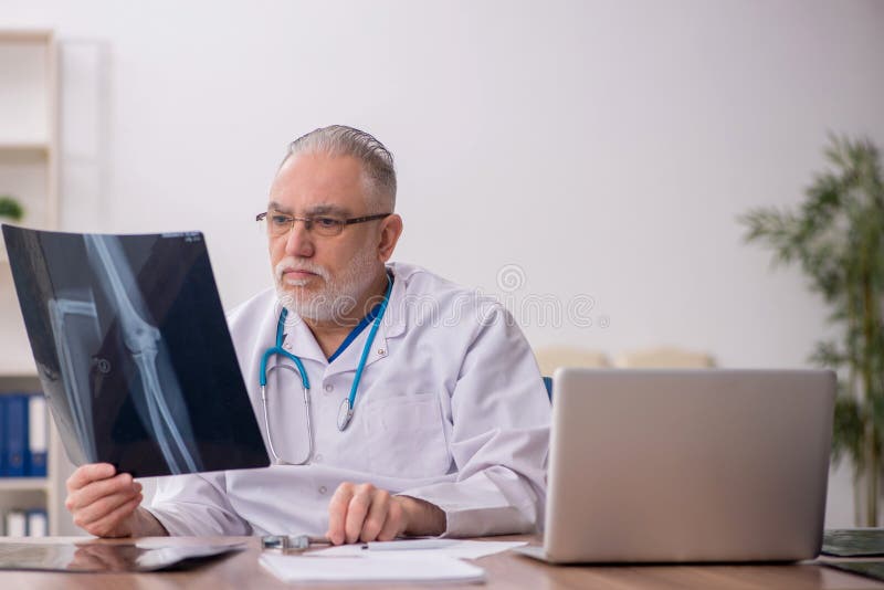 Old Male Doctor Radiologist Working in the Clinic Stock Image - Image ...