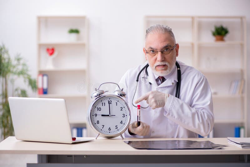Old Male Doctor in Time Management Concept Stock Photo - Image of ...