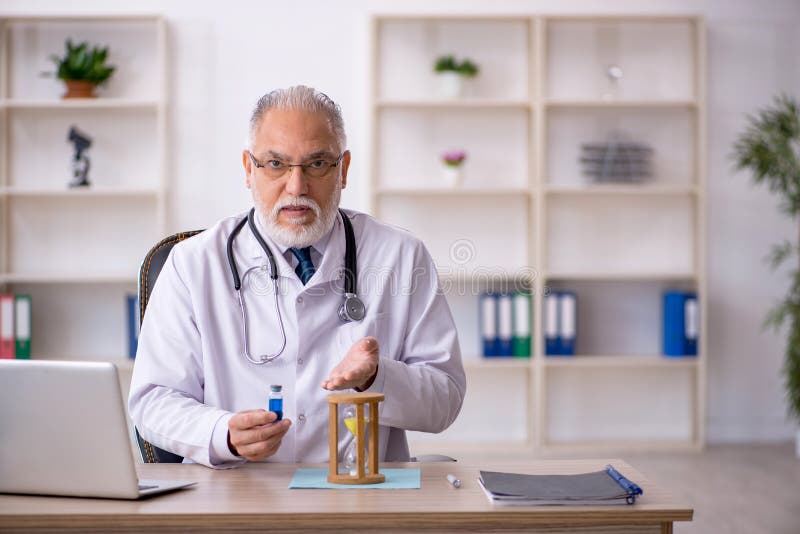Old Male Doctor in Time Management Concept Stock Photo - Image of timer ...
