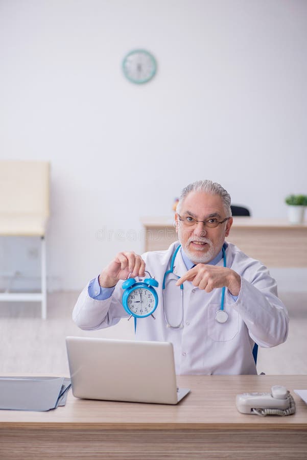 Old Male Doctor in Time Management Concept Stock Photo - Image of alarm ...