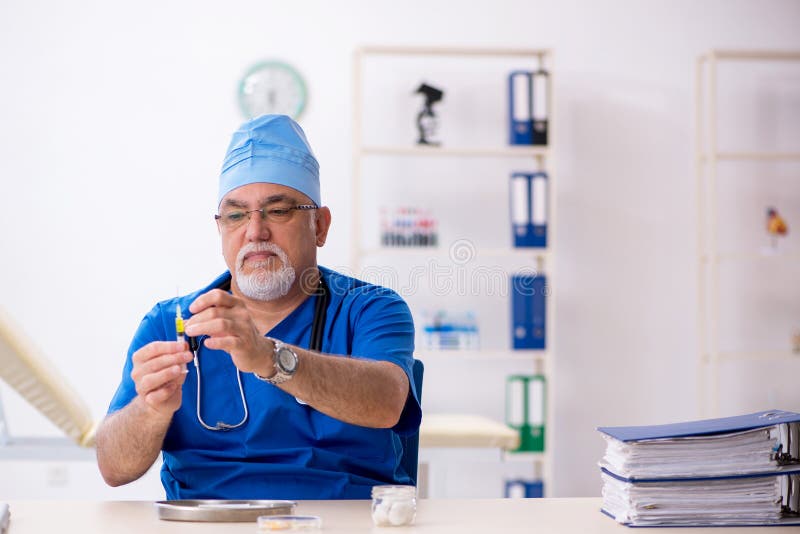 Old Male Doctor Working in the Clinic Stock Image - Image of doctor ...