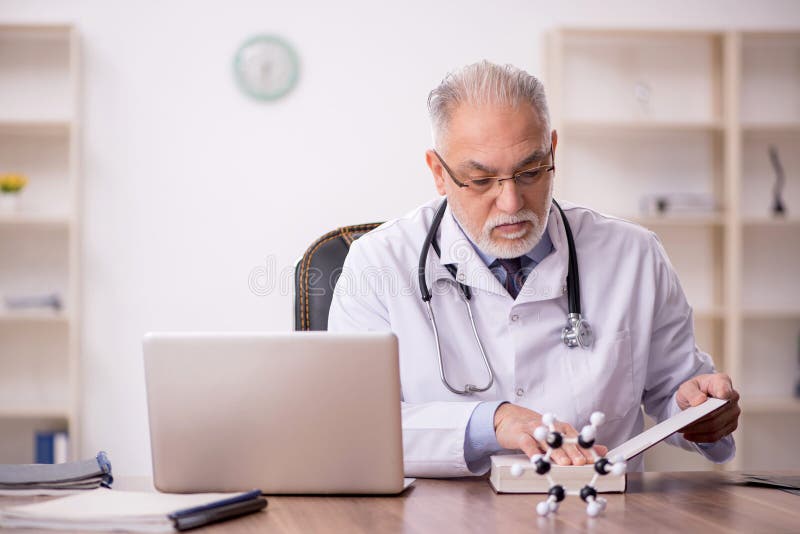 Old Male Doctor Working in the Clinic Stock Photo - Image of rules ...