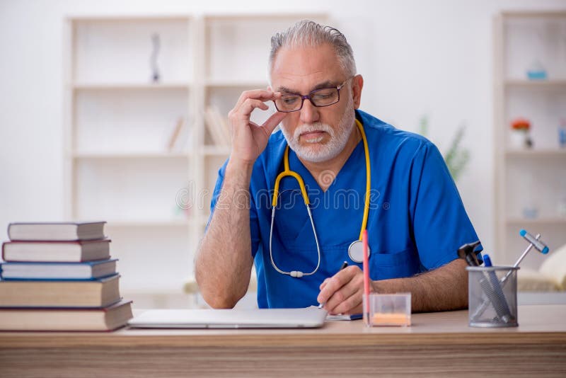 Old Male Doctor Working in the Clinic Stock Image - Image of clinic ...