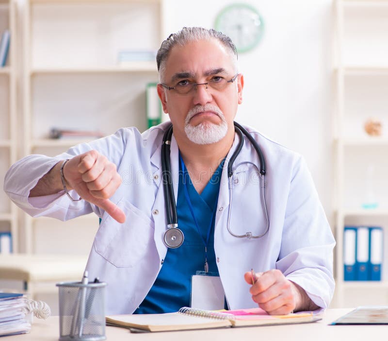 Old Male Doctor Working in the Clinic Stock Image - Image of discussing ...