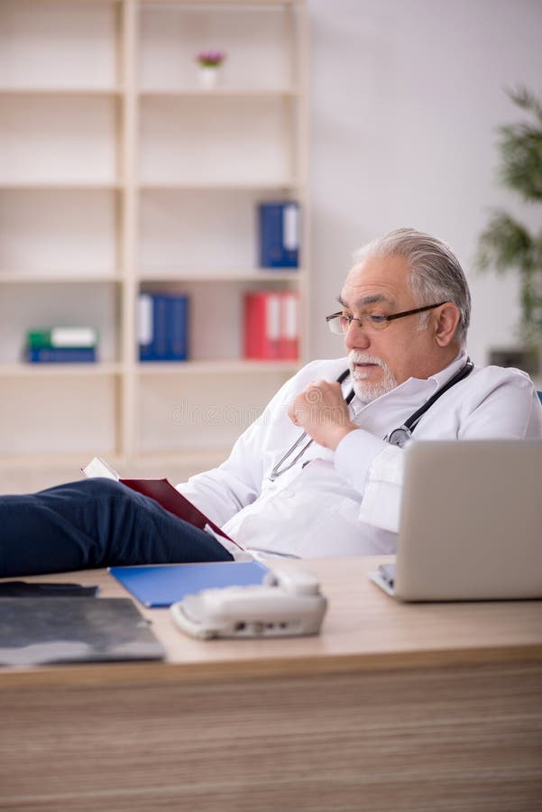 Old Male Doctor Working in the Clinic Stock Image - Image of doctor ...