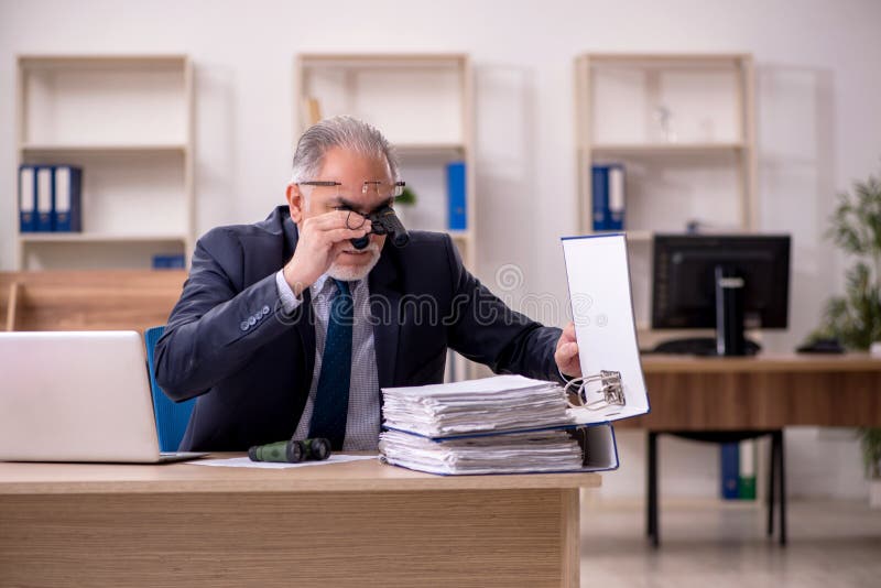 Old Male Employee Auditor Holding Binoculars at Workplace Stock Image ...