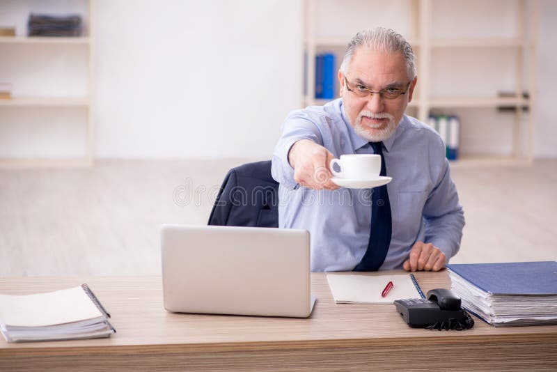 Old Male Employee Drinking Tea in the Office Stock Photo - Image of ...
