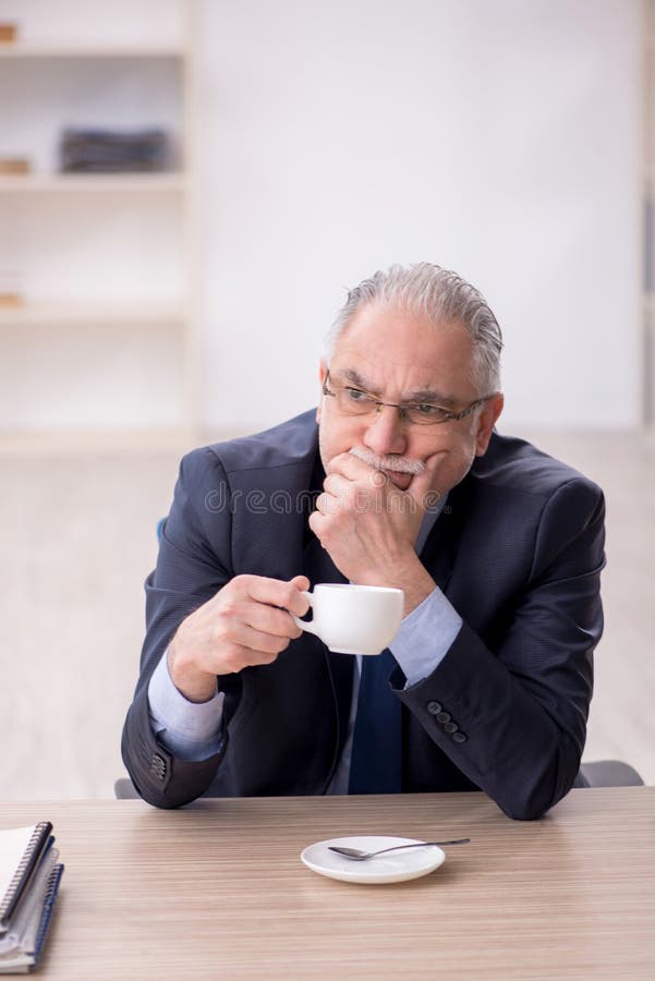 Old Male Employee Drinking Tea in the Office Stock Photo - Image of ...