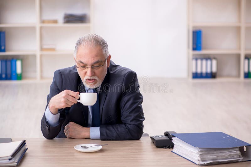 Old Male Employee Drinking Tea in the Office Stock Photo - Image of ...
