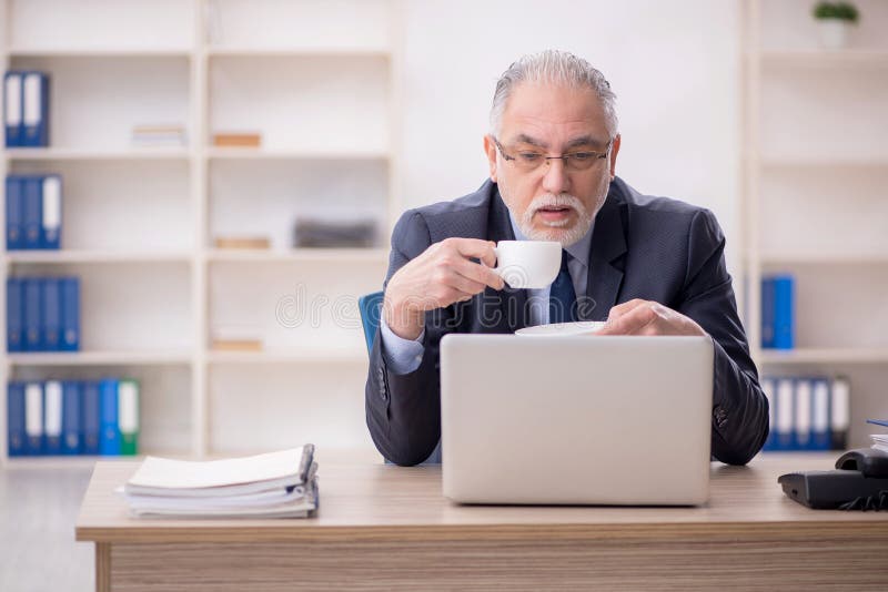 Old Male Employee Drinking Tea in the Office Stock Image - Image of ...