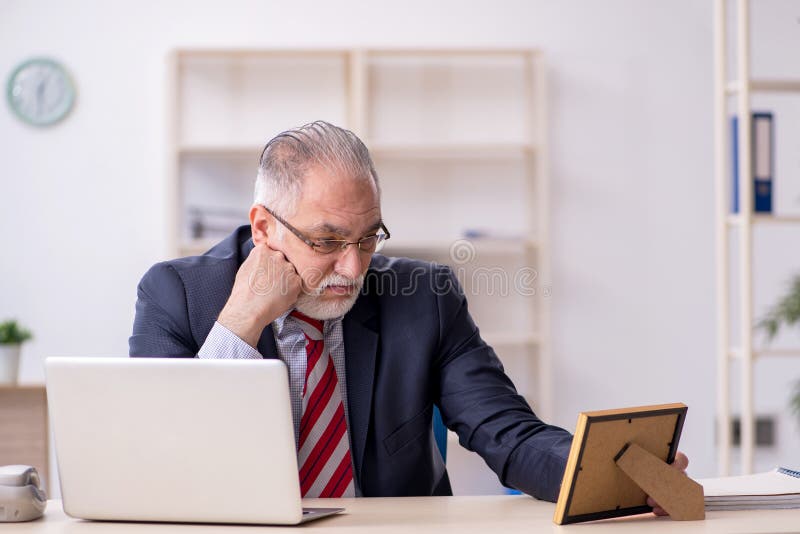 Old Male Employee Missing Wife at Workplace Stock Image - Image of ...