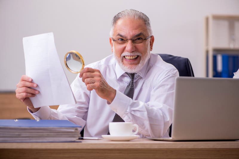 Old Male Employee Reading Paper in the Office Stock Image - Image of ...