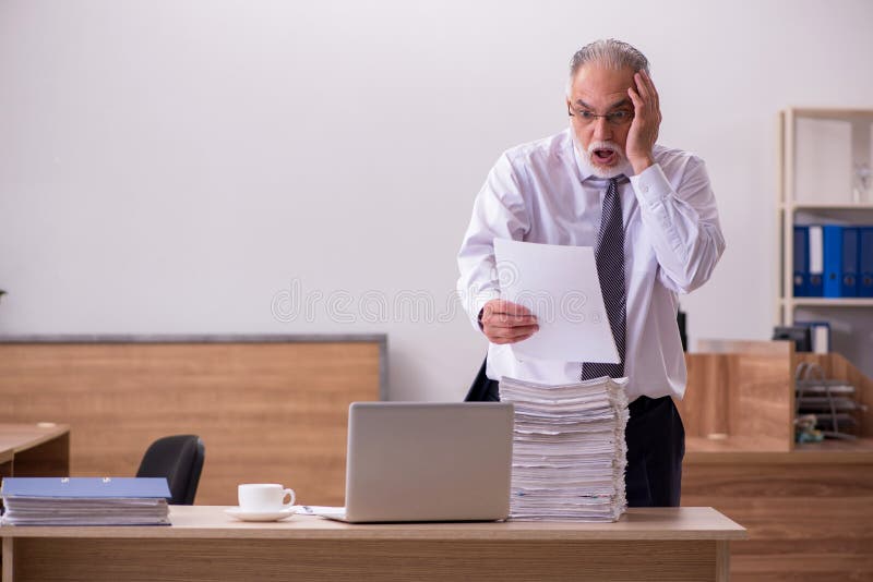 Old Male Employee Reading Paper in the Office Stock Photo - Image of ...