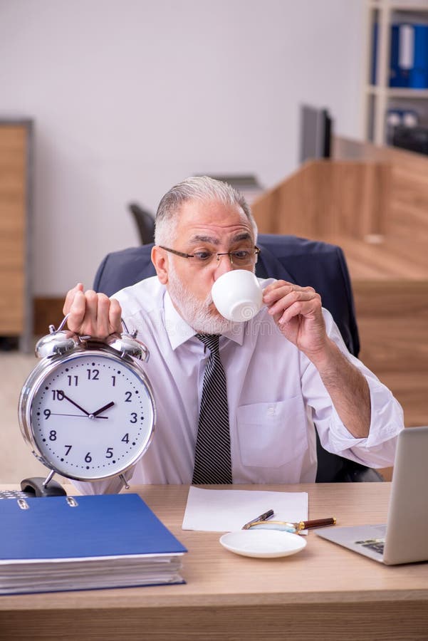 Old Male Employee in Time Manegement Concept Stock Photo - Image of ...