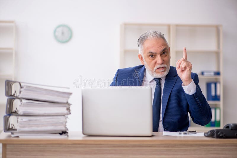 Old Male Employee and Too Much Work in the Office Stock Image - Image ...