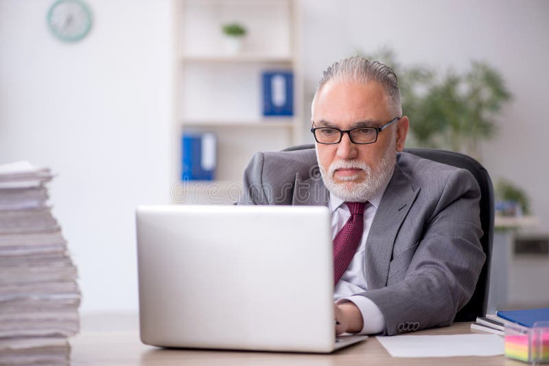 Old Male Employee and Too Much Work in the Office Stock Photo - Image ...