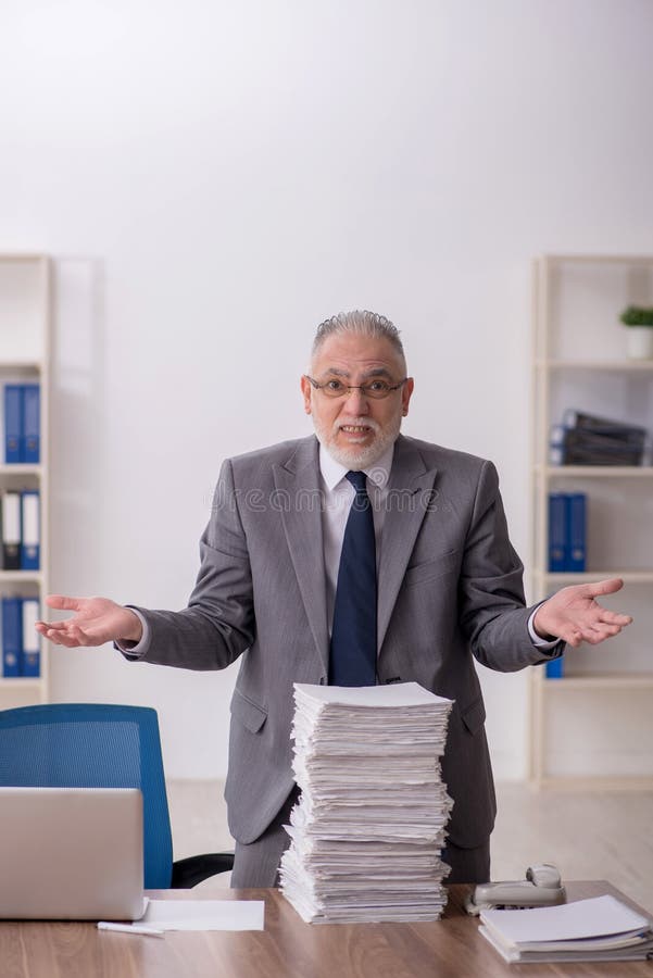 Old Male Employee and Too Much Work at Workplace Stock Image - Image of ...
