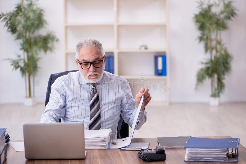 Old Male Employee and Too Much Work at Workplace Stock Image - Image of ...