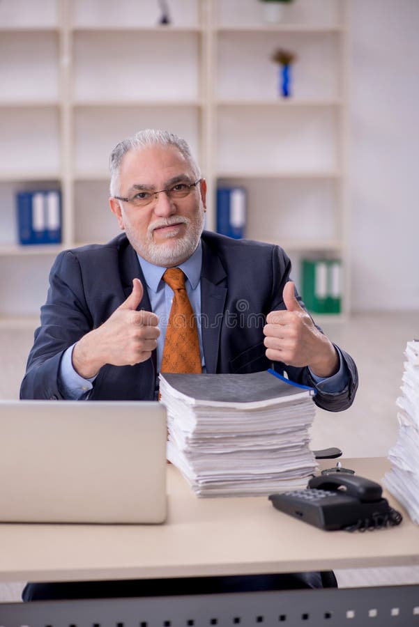 Old Male Employee Unhappy with Excessive Work in the Office Stock Photo ...