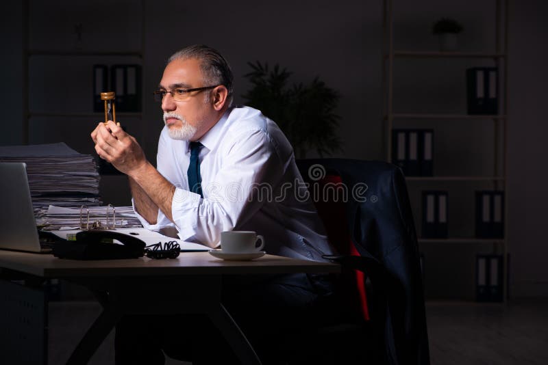 Old Male Employee Working Late at Workplace Stock Image - Image of ...