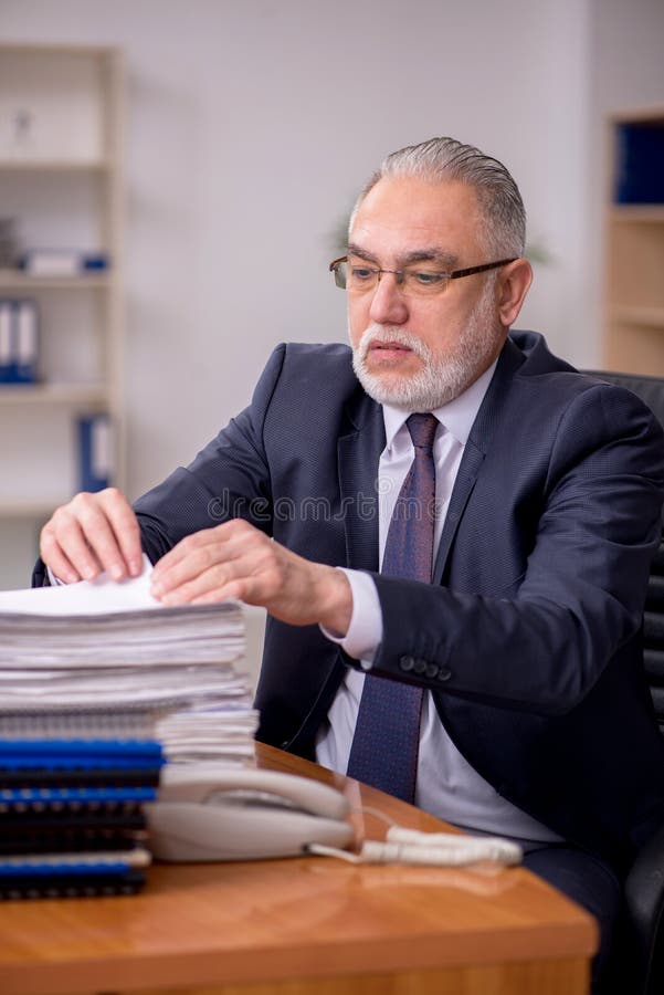 Old Male Employer and Too Much Work in the Office Stock Image - Image ...