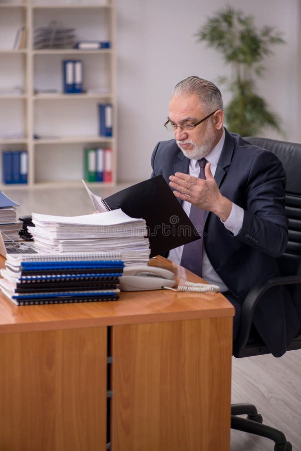 Old Male Employer and Too Much Work in the Office Stock Photo - Image ...