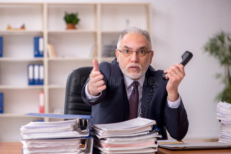 Old Male Employer and Too Much Work in the Office Stock Image - Image ...