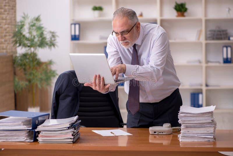 Old Male Employer and Too Much Work in the Office Stock Photo - Image ...